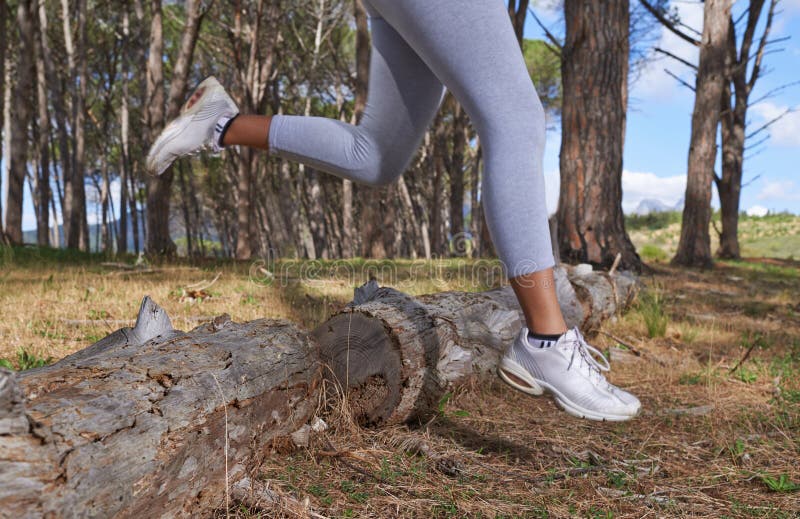 Going for a Trail Run. Cropped View of a Womans Legs Running through a ...