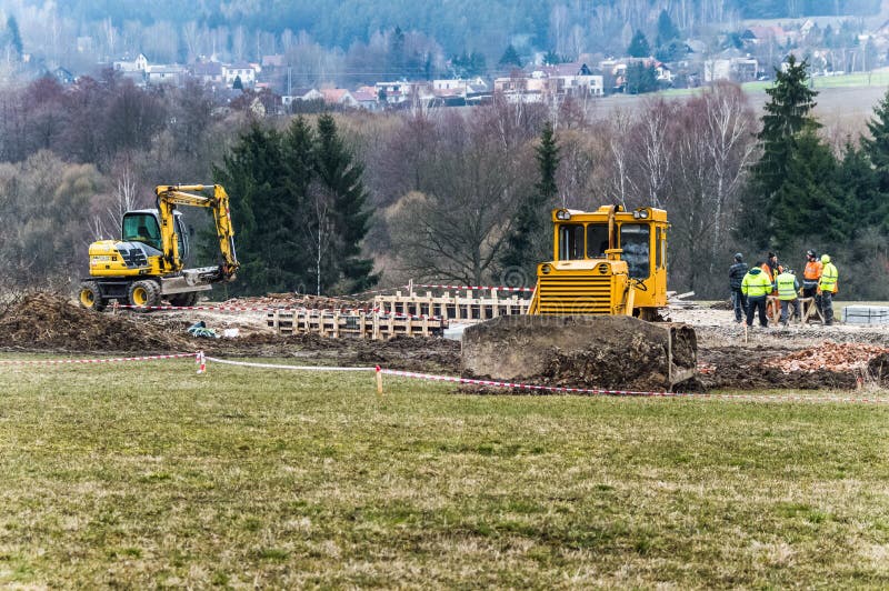 On Going Work at a Construction Site with a Group of Workers on One ...