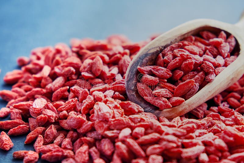 Goji in Bowl on Wood Table. Top View of Fresh Goji in Scoop and Bowl ...