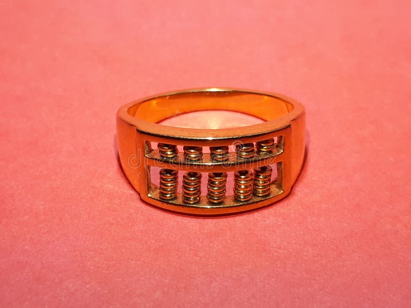 Gold Abacus ring for men stock image. Image of ring - 186731205