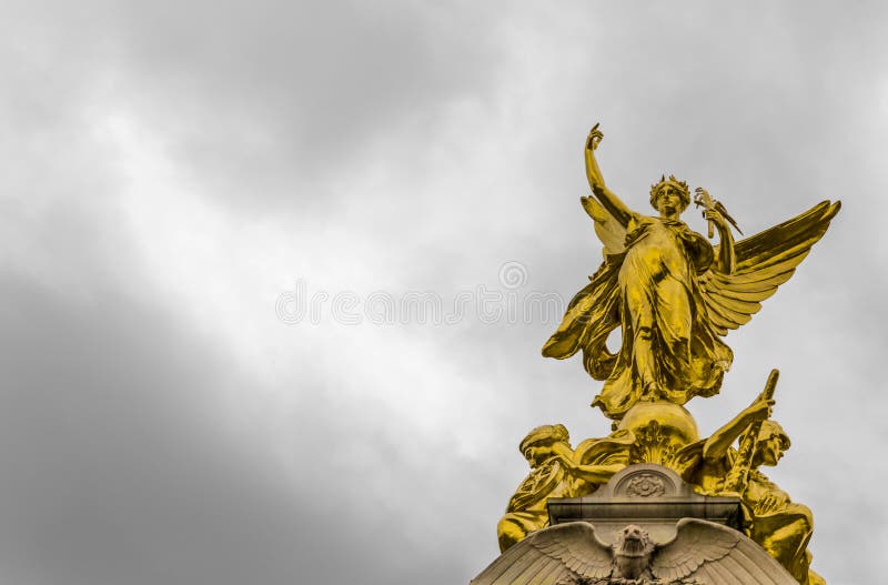 Gold Angel Statue Under Grey Clouds Stock Image - Image of golden ...