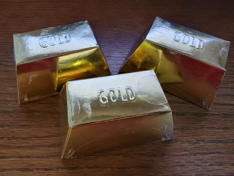 Gold Bars or Blocks on Wood Desk or Surface Stock Photo - Image of ...