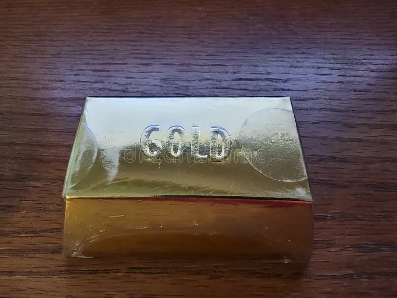Gold Bars or Blocks on Wood Desk or Surface Stock Image - Image of ...