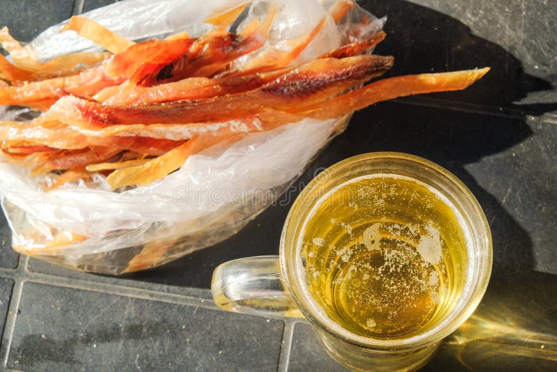 Gold beer with fish stock photo. Image of sabrefish - 116897830