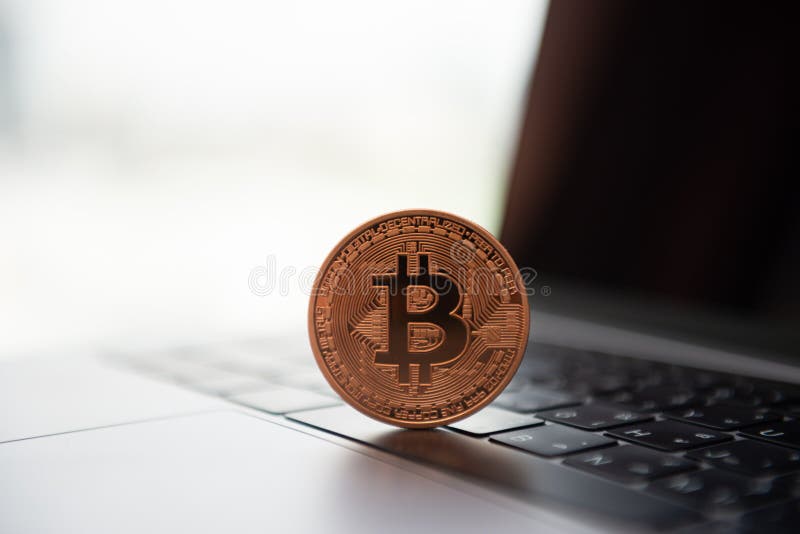 Gold Bit Coin on the Computer Laptop - Close Up Stock Photo - Image of ...