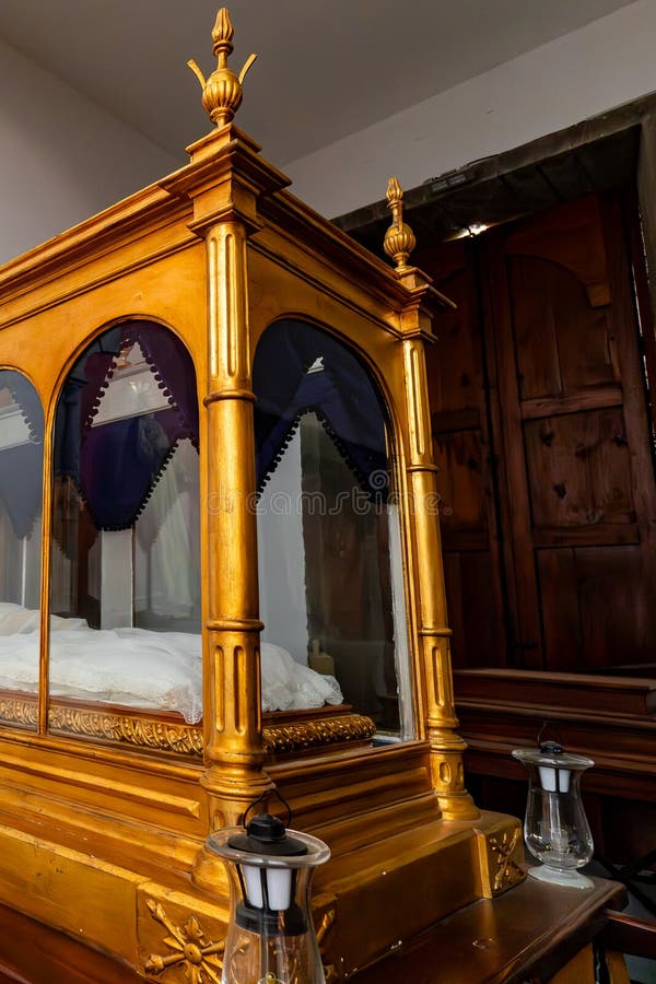 A Gold and Blue Box with a White Bed Inside Editorial Photography ...