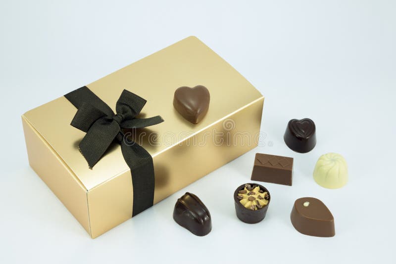 Gold Box with Assorted Chocolates. Stock Photo - Image of confectionery ...