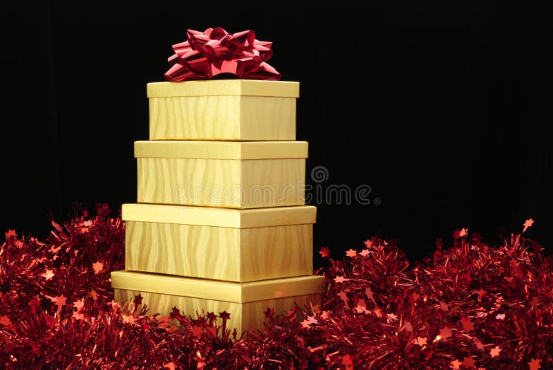 Gold Boxes Red Bow Red Garland Stock Image - Image of gold, holiday ...