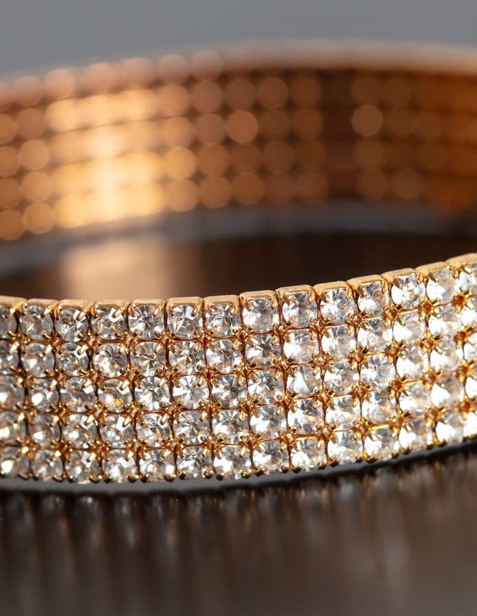 Gold Bracelet with Precious Stones Isolated on a Black Background Stock ...