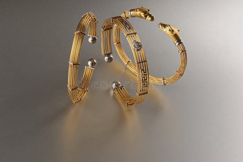 Gold Bracelets for Men and Its Reflection on Silver-colored Cardboard ...