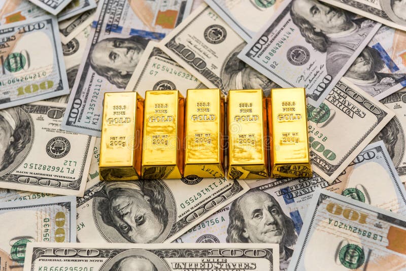 Gold Bullion Lying on Us Money Stock Photo - Image of abundance ...