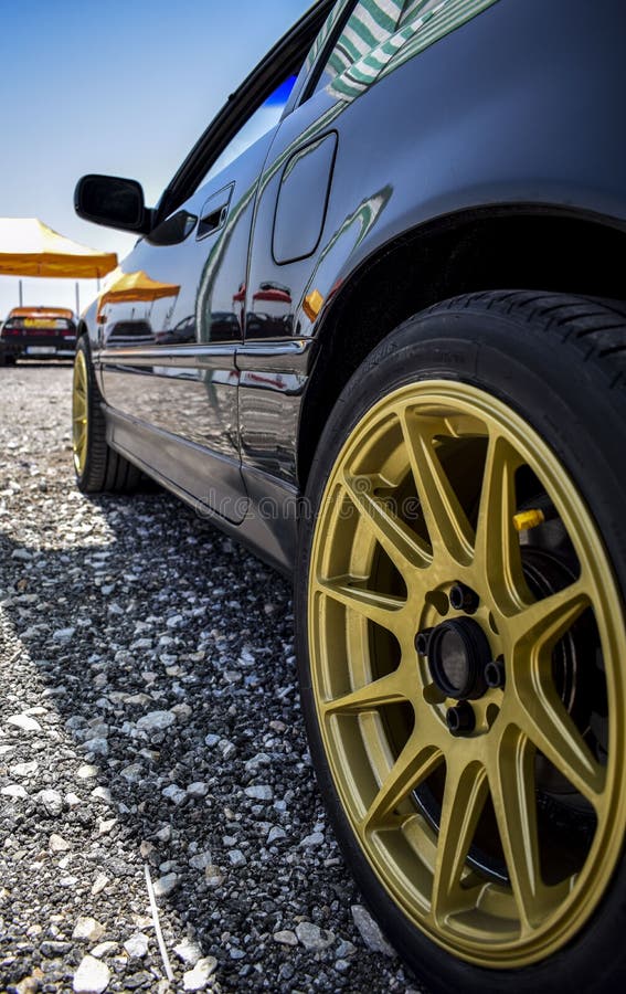 Gold car rim in close-up stock image. Image of closeup - 178556453