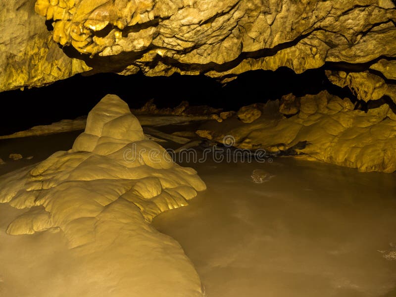 Gold cave in the mountain stock illustration. Illustration of water ...