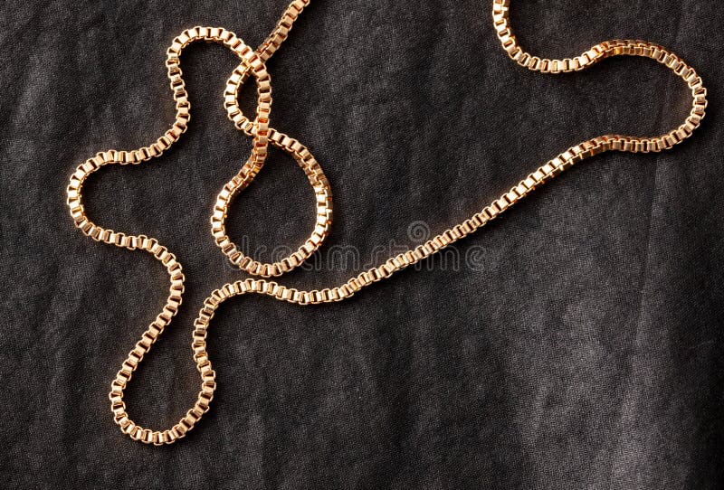 Gold Chain on Black Silk Fabric. Close-up Stock Image - Image of ...