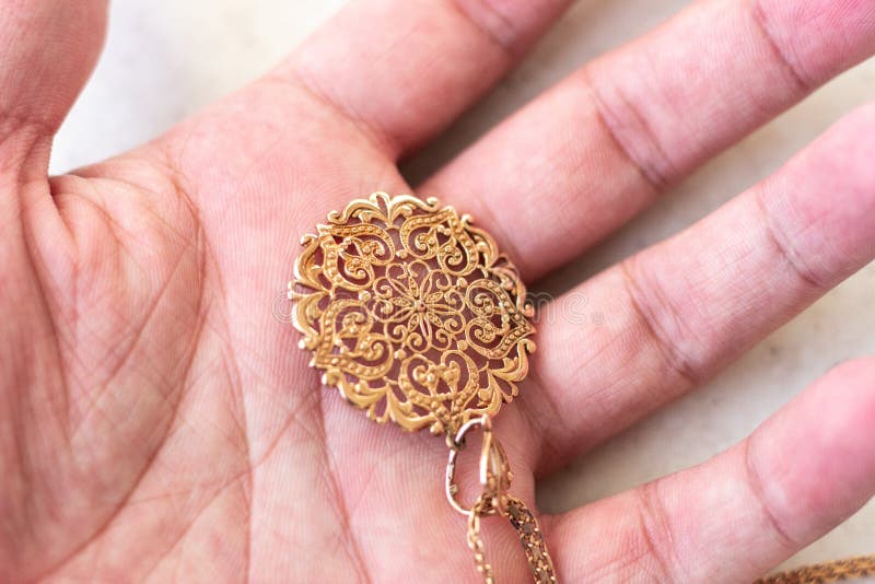 Gold Chain on the Palm. Golden Ring in the Palm of. Round Gold on the ...