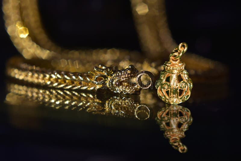 Gold chain and pendant stock image. Image of metal, metallic - 266798595