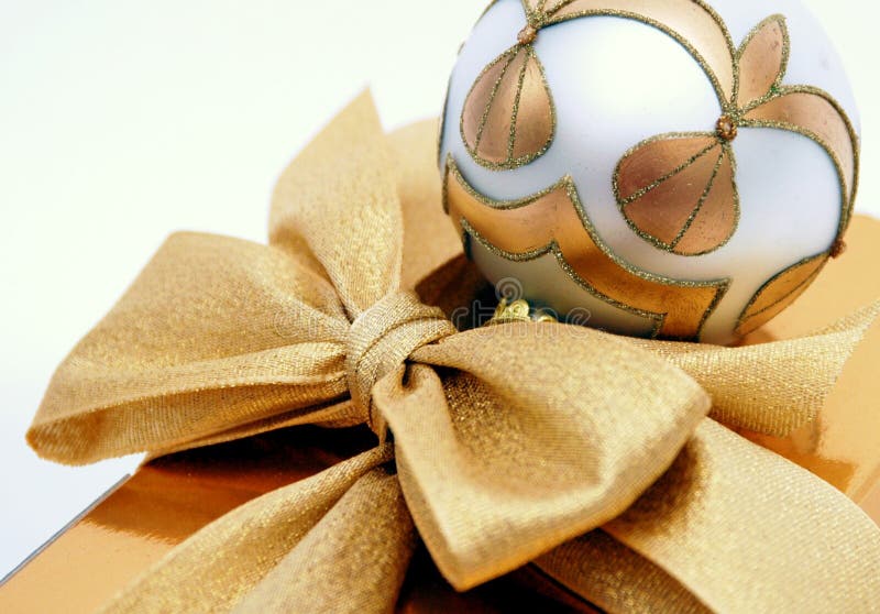 Gold Christmas Ball and Bow Stock Photo - Image of dearest, giving: 2973126