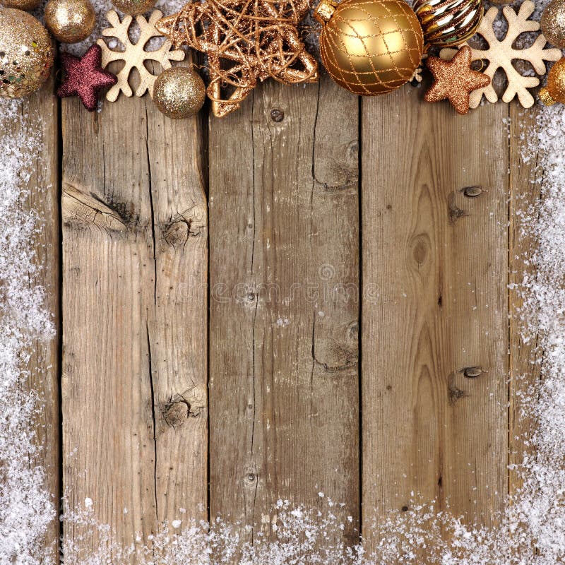 Gold Christmas Ornament Top Border with Snow Frame on Wood Stock Photo ...