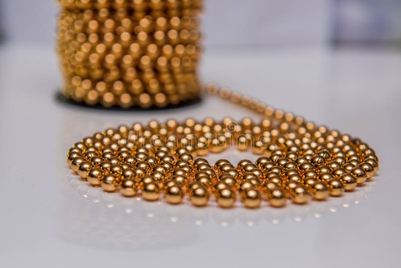 Gold coil stock image. Image of coil, gold, chain, table - 112868593