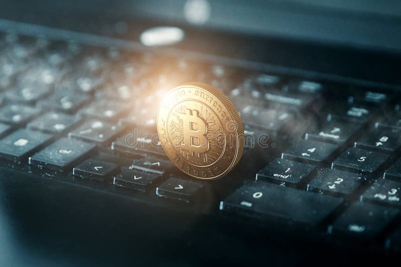 Gold Coin Bitcoin on a Black Keyboard. the Concept of Crypto Currency ...