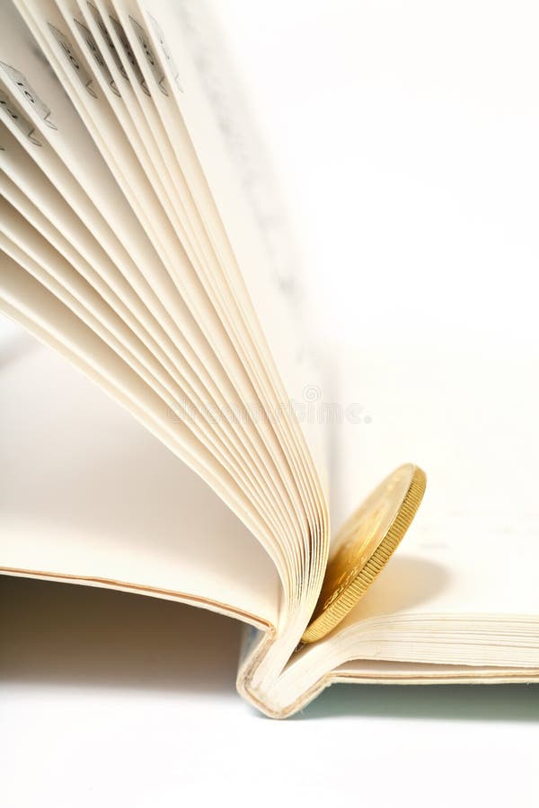 Gold coin in book stock photo. Image of pages, abstract - 13776132