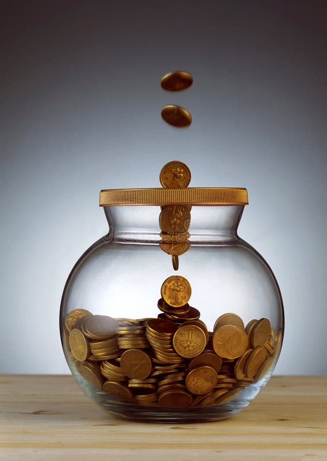 Dropping Coins in a Glass Jar Stock Photo - Image of glass, white: 11225292