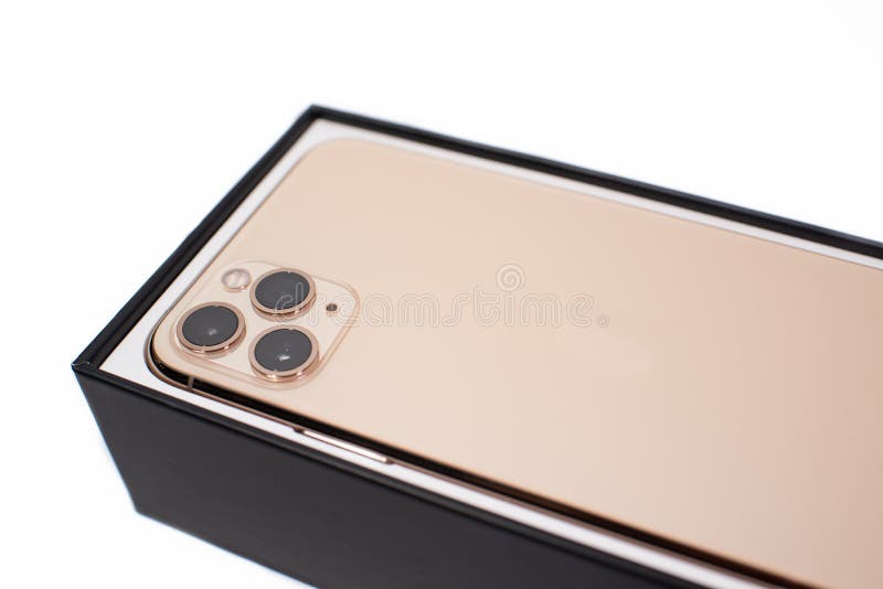 Gold-colored Smartphone with Three Cameras on a White Background. Stock ...