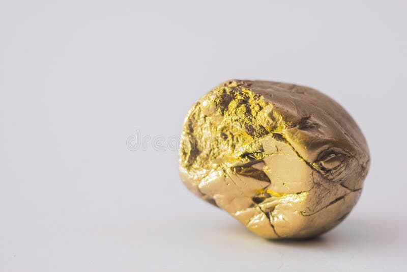 Gold-colored Stones in Natural Shape on a White Background with Stock ...