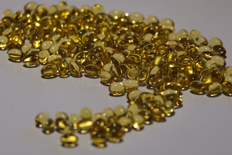 Gold-colored Tablets on the Table Stock Image - Image of icon, pill ...