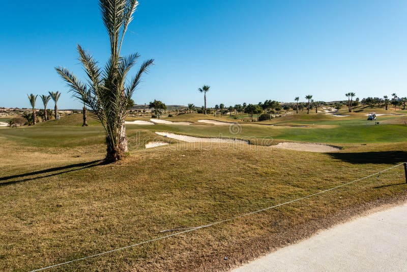 Gold Course with Trees and Pathways Under a Clear Blue Sky in Spain ...