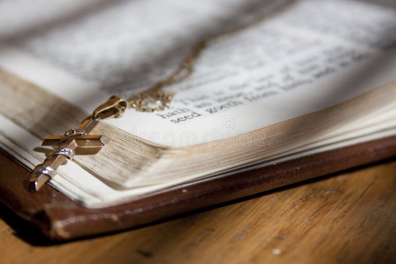 Gold Cross on Holy Bible stock photo. Image of gold, holy - 18751232