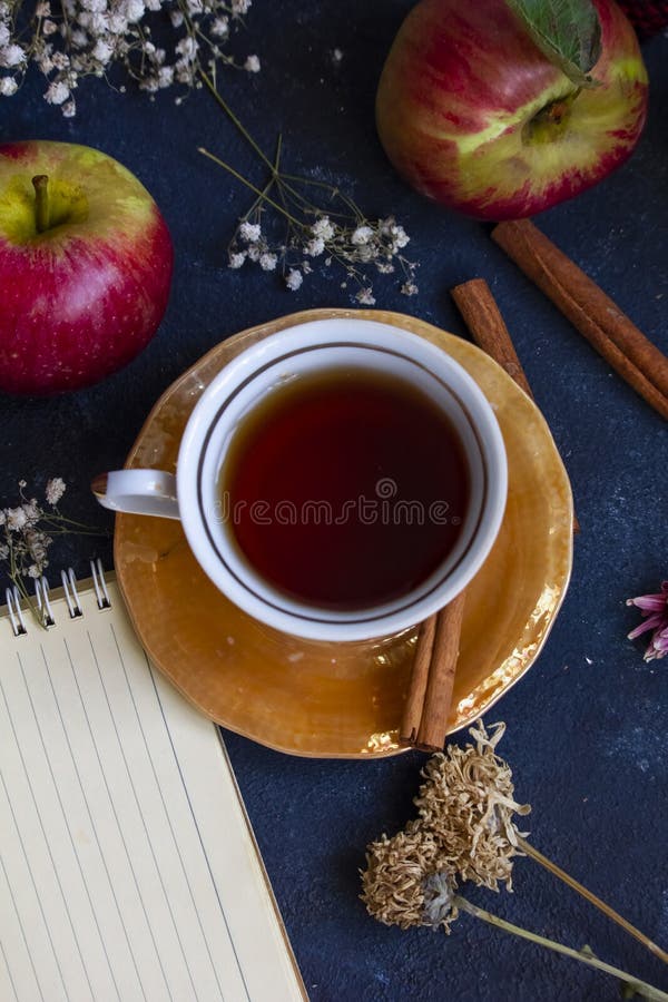 Cup of tea with red apple stock image. Image of fall - 123984177