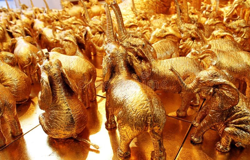 Gold Elephants stock photo. Image of tusks, trunksupraised - 46465152