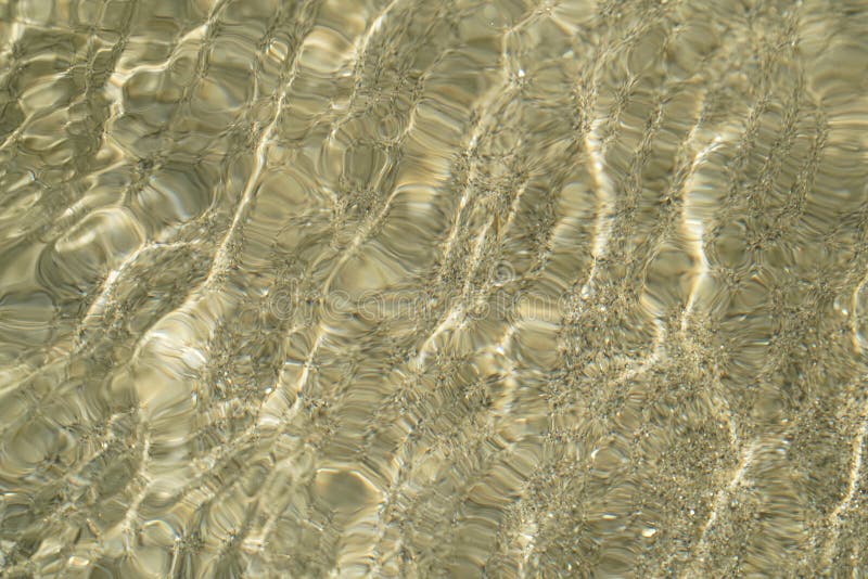 Gold flakes in a river stock image. Image of texture - 261535919