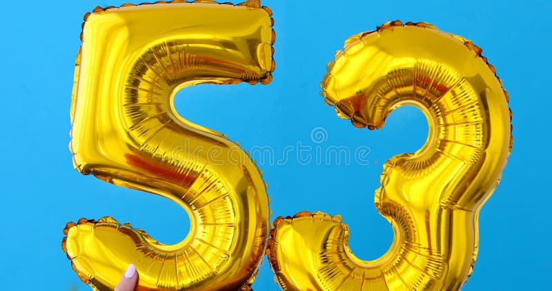 Gold Foil Number 53 Celebration Balloon on a Blue Stock Photo - Image ...