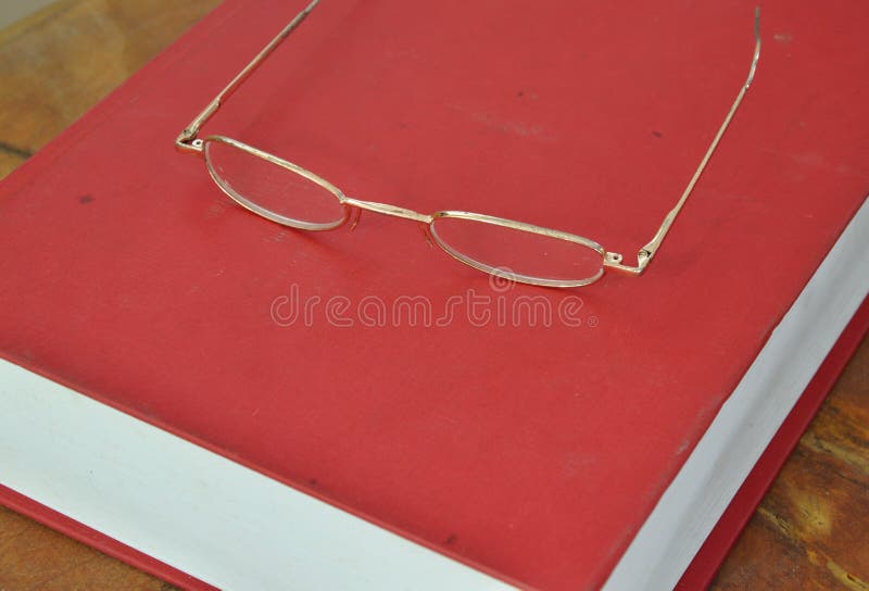 Gold Frame Eyeglass on Red Book Stock Photo - Image of education ...