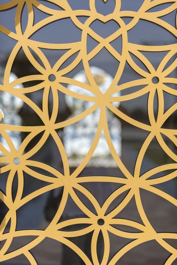 Gold Geometric Pattern on Glass with Blurred Background Stock Image ...