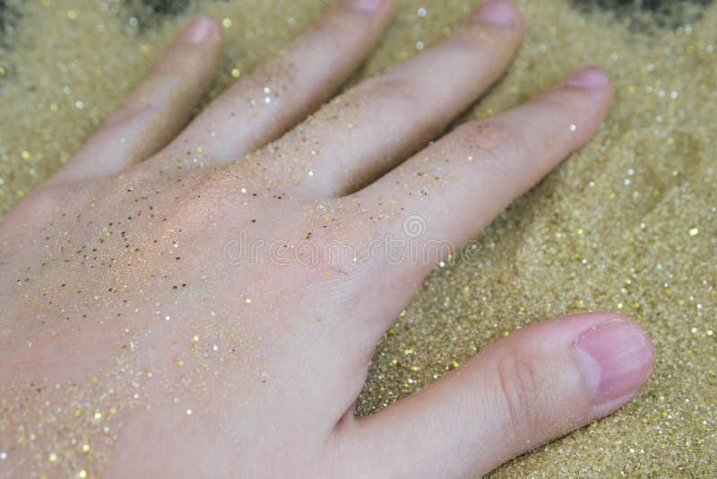 Gold glitter on back hand stock photo. Image of beautiful - 67702760