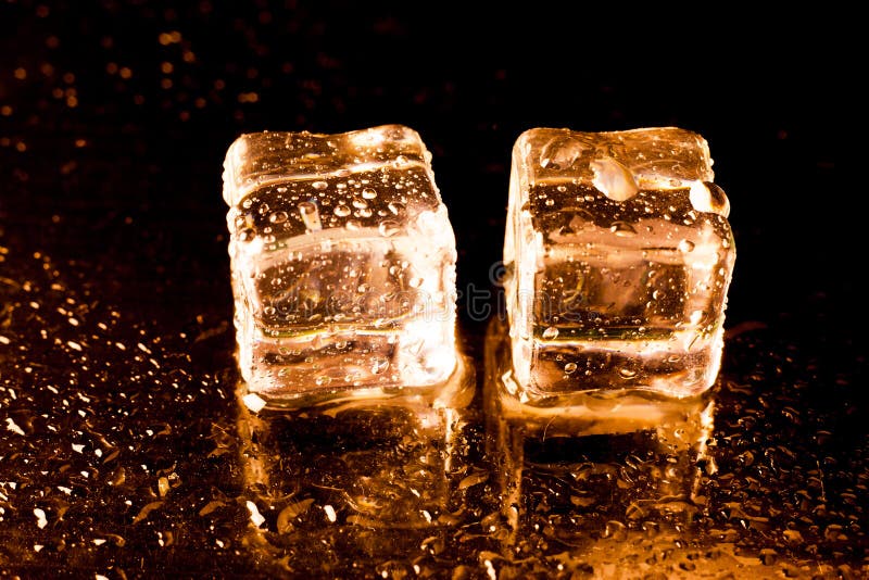 Gold Ice Cubes on Black Background Stock Photo - Image of light ...