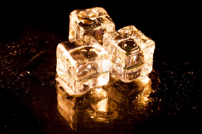 Gold Ice Cubes on Black Background Stock Image - Image of crystal ...