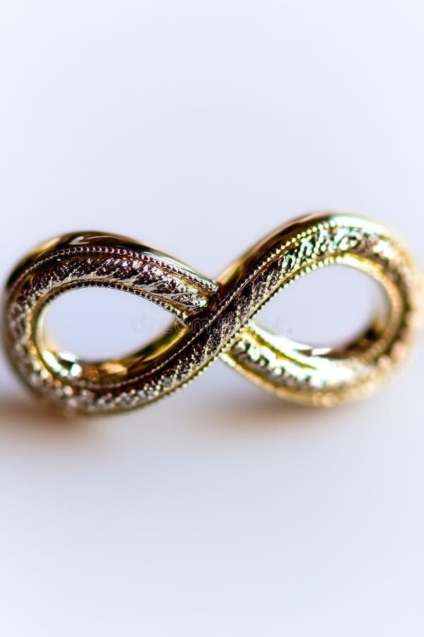 Gold Infinity Symbol with Diamond Detailing on White Background Stock ...