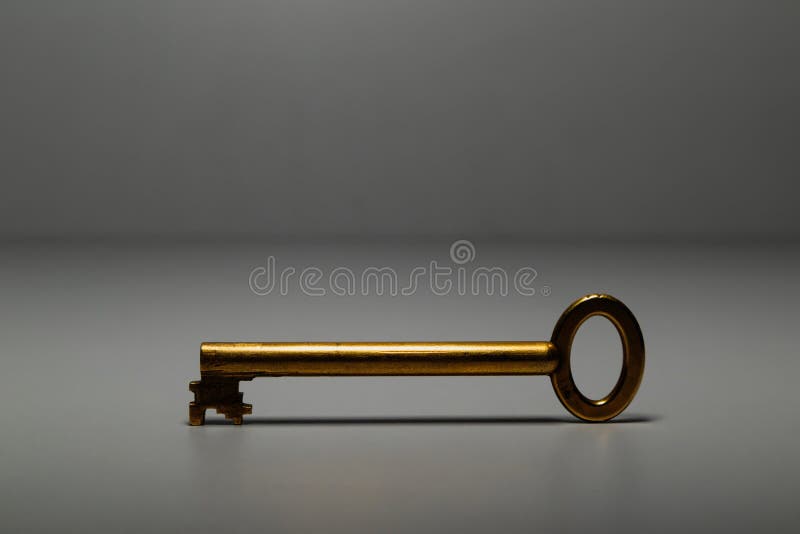 Gold Key on a Gray Background in the Dark. Low Key Stock Photo - Image ...