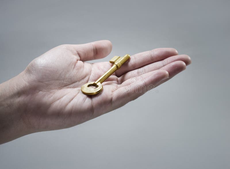 Gold key on human hand. stock image. Image of enter, concept - 99771205
