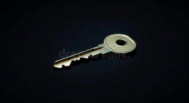 Gold Key is Laying on a Black Surface Stock Image - Image of auto ...