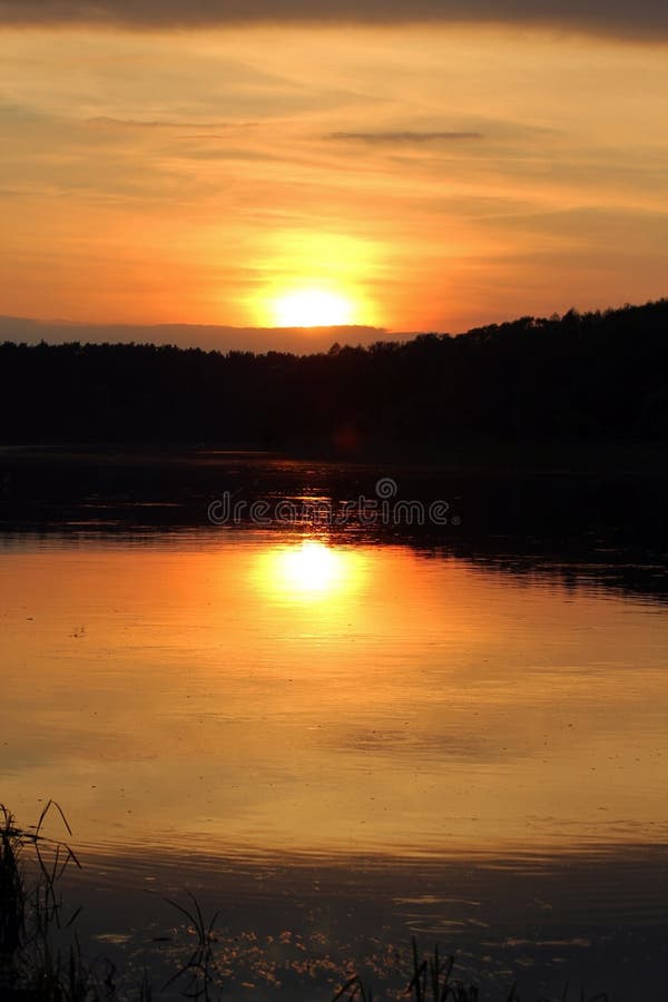 Sun set time on the lake stock image. Image of water - 104347345