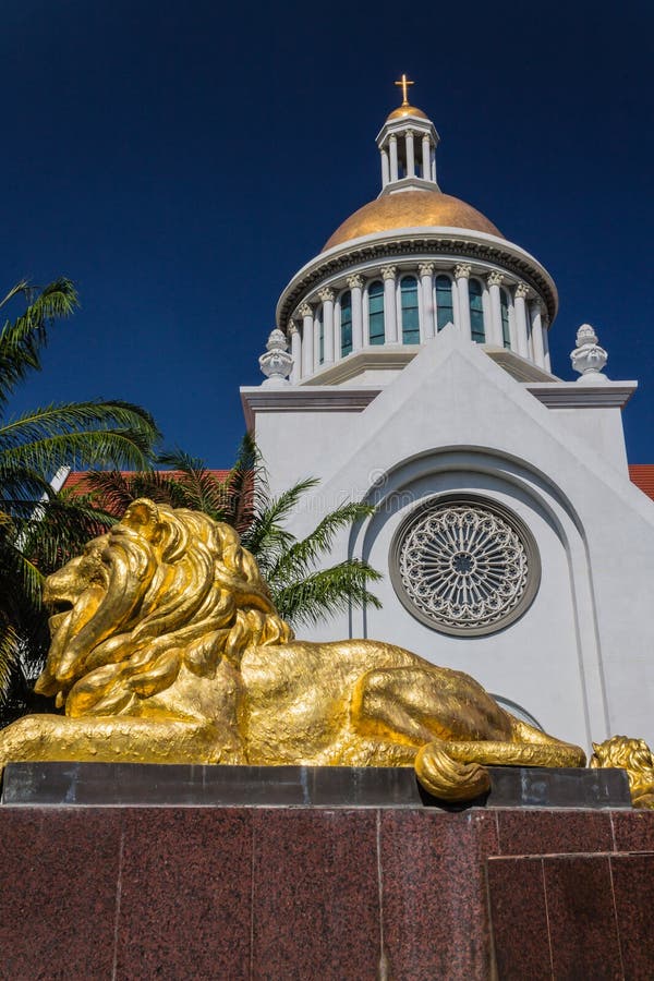 Gold Lion Statue in Front of Church Stock Image - Image of stand ...