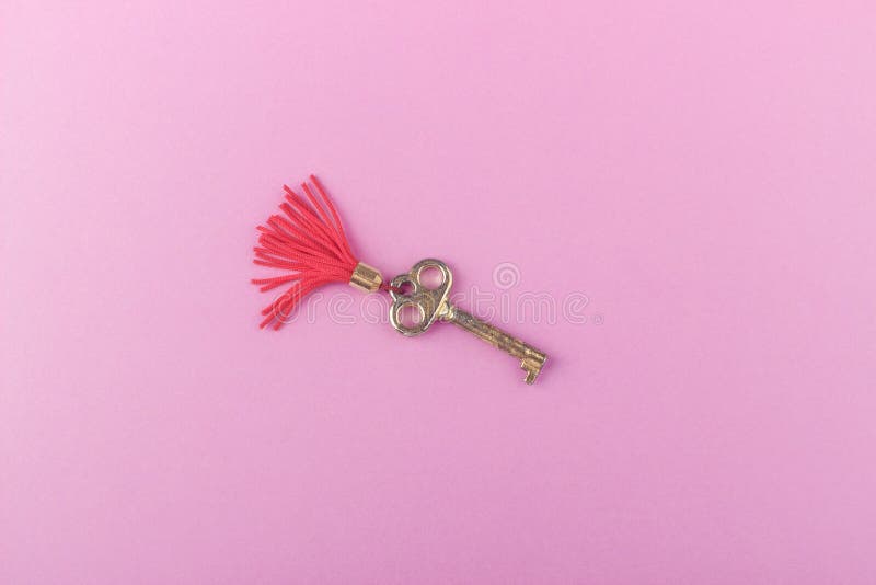 Gold Metal Key on Light Pink Base, Top View Stock Photo - Image of base ...