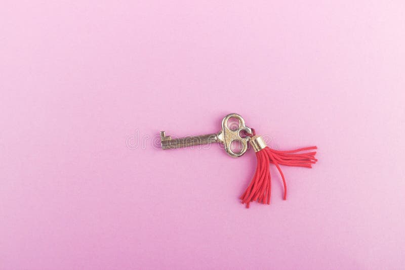 Gold Metal Key on Light Pink Base, Top View Stock Photo - Image of base ...
