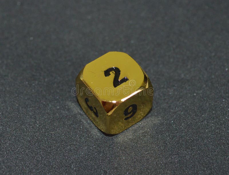 Gold Metallic D6 Six Sided Dice on Foam Surface in Bright Sunshine ...