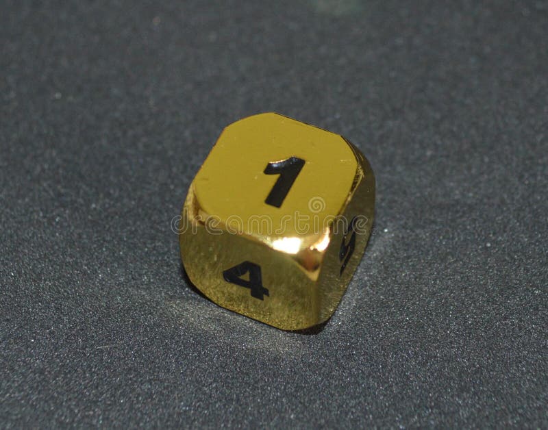 Gold Metallic D6 Six Sided Dice on Foam Surface in Bright Sunshine ...